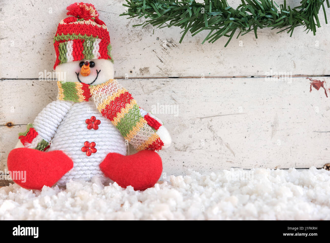 snowman sitting on snow in vintage background Stock Photo - Alamy
