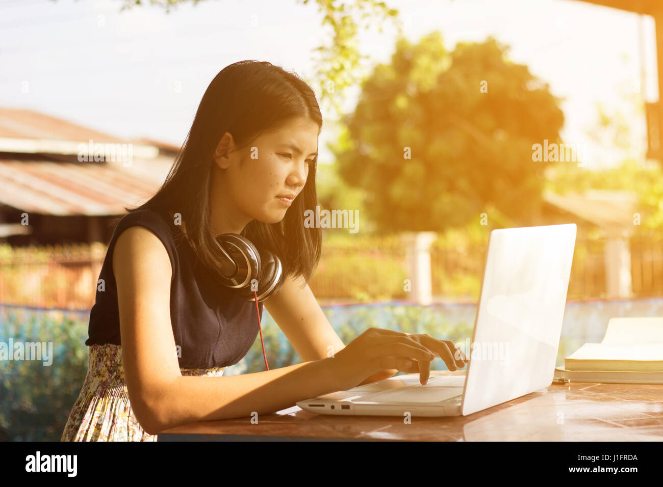 Asian girl using laptop studying hi-res stock photography and images ...