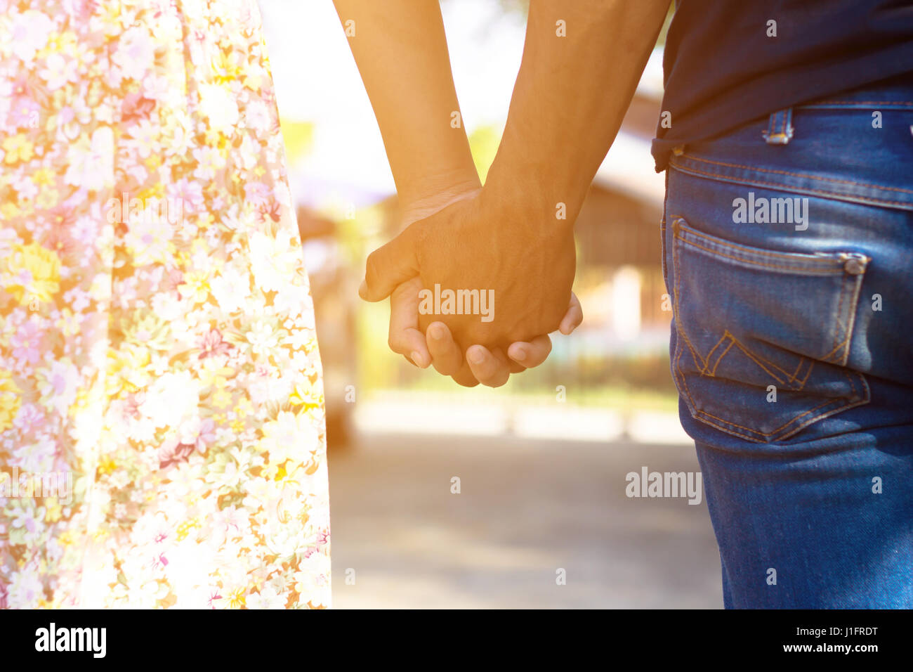 Couples holding hands Stock Photo - Alamy