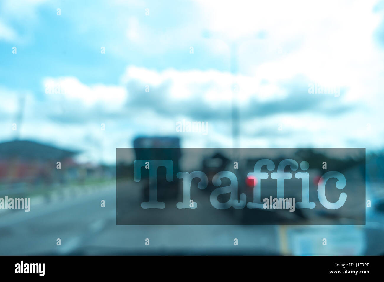 Traffic text with blurred background Stock Photo - Alamy