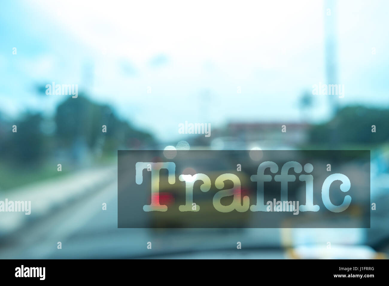 Traffic text with blurred background Stock Photo - Alamy