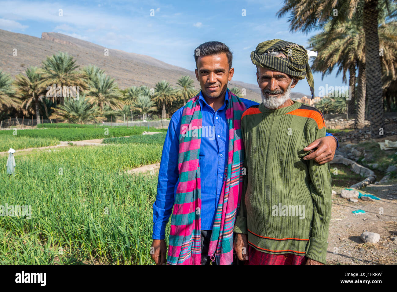 Oman; Wadi Ghul, Portrait of Arab men in oasis farm field Stock Photo ...