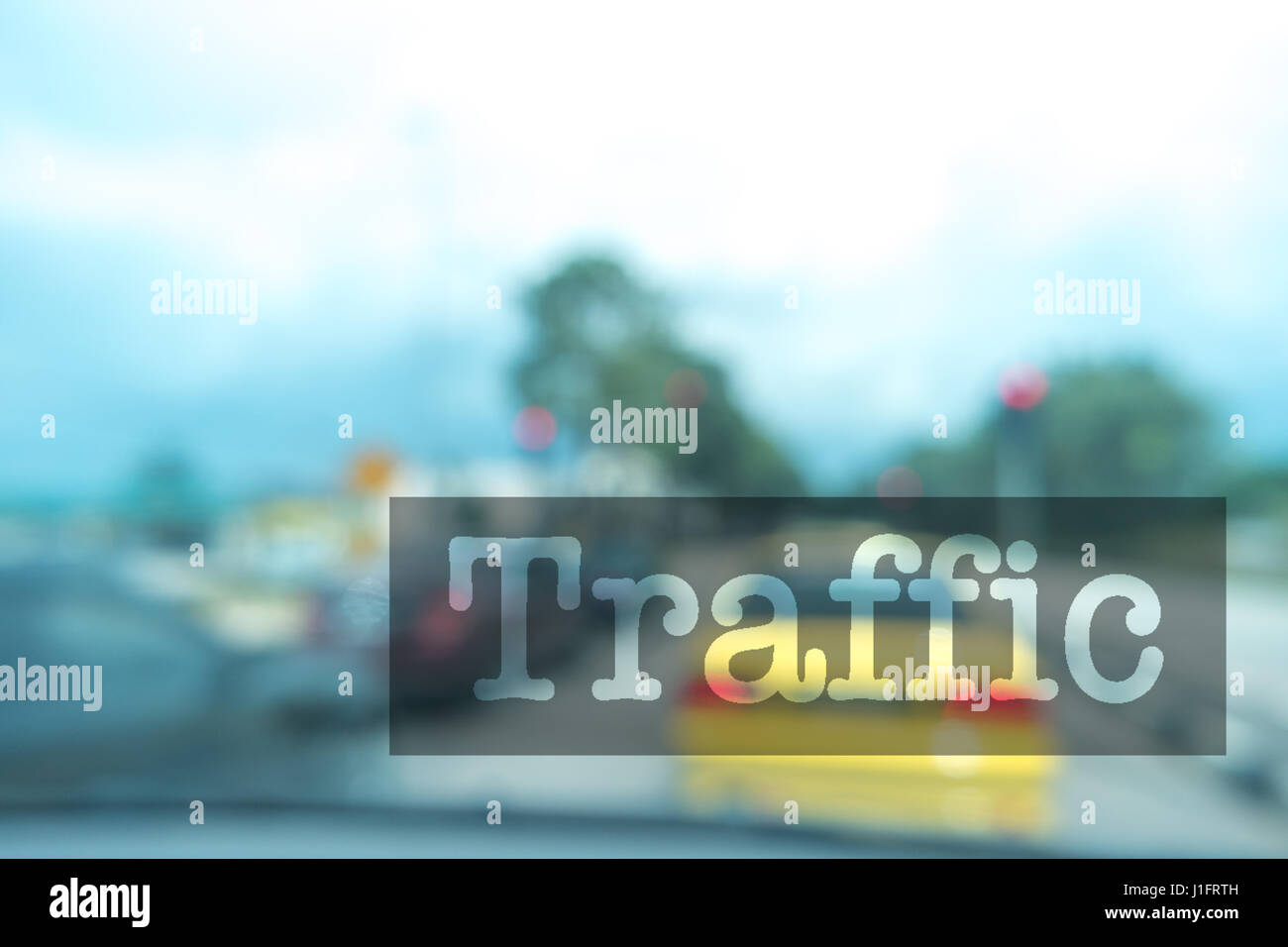 Traffic text with blurred background Stock Photo - Alamy