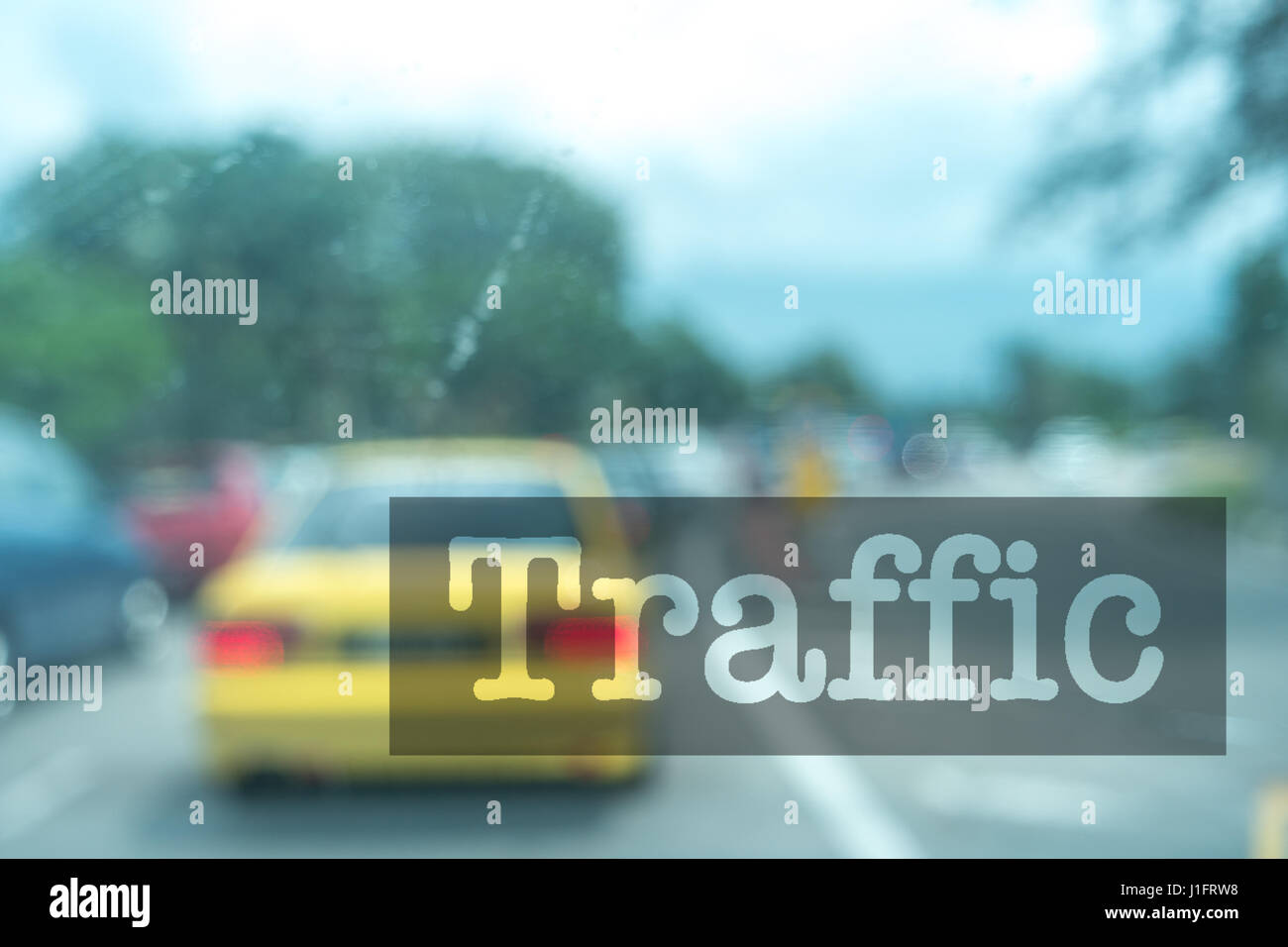 Traffic text with blurred background Stock Photo - Alamy