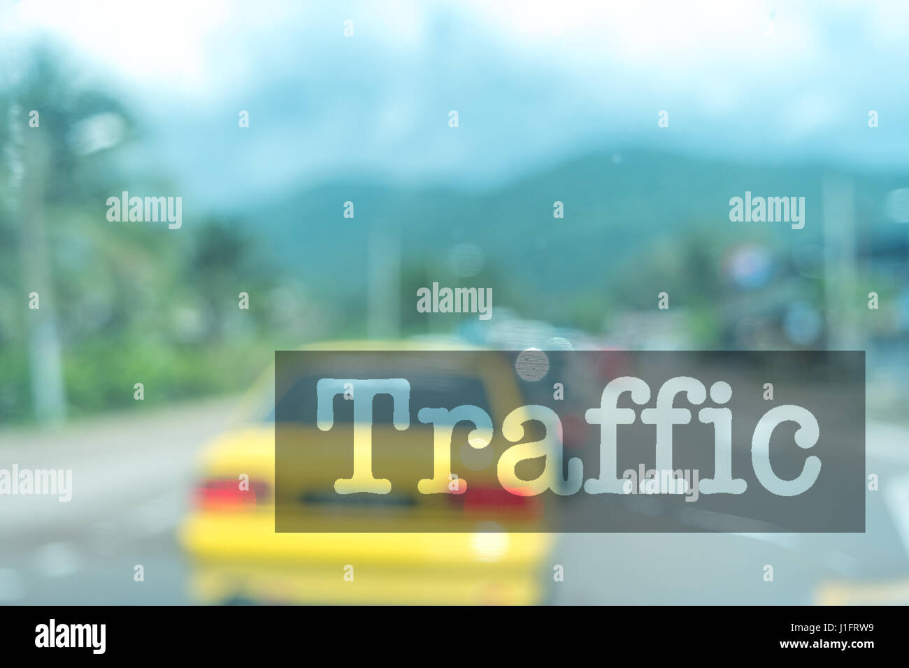 Traffic text with blurred background Stock Photo - Alamy