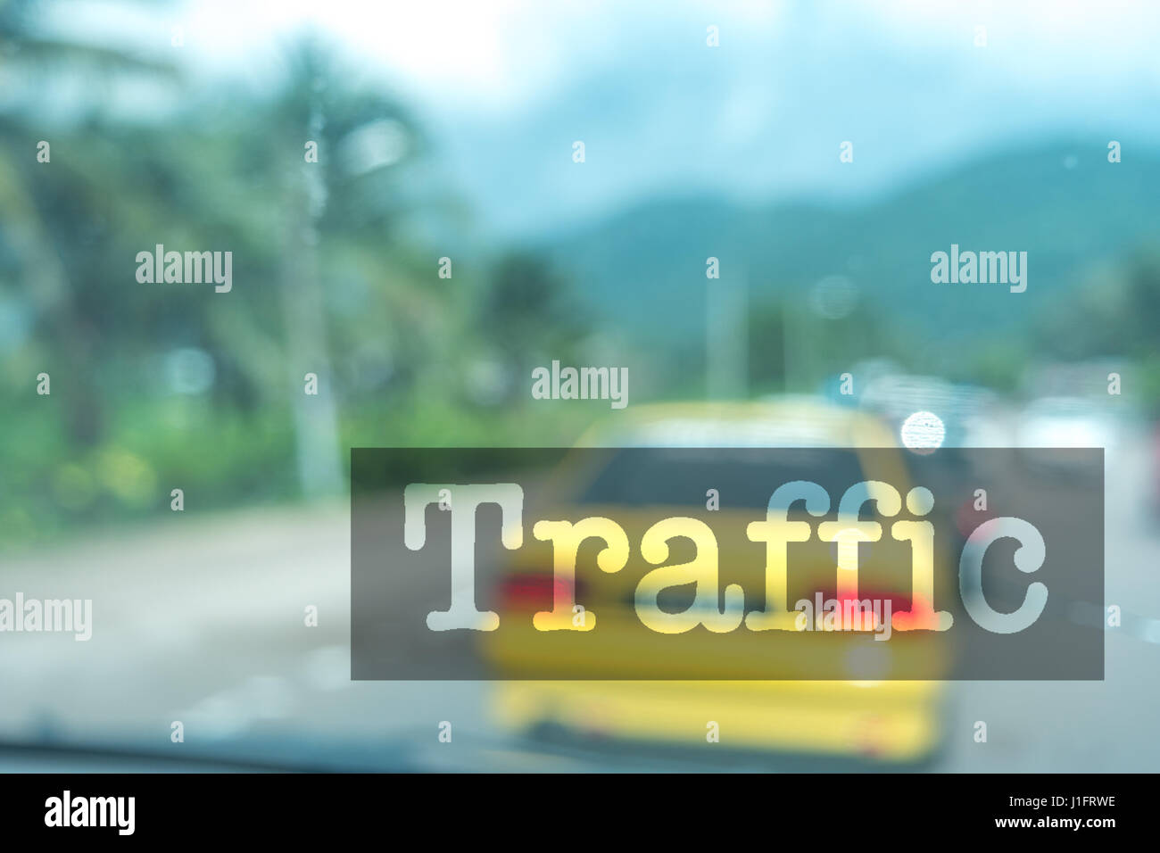 Traffic text with blurred background Stock Photo - Alamy