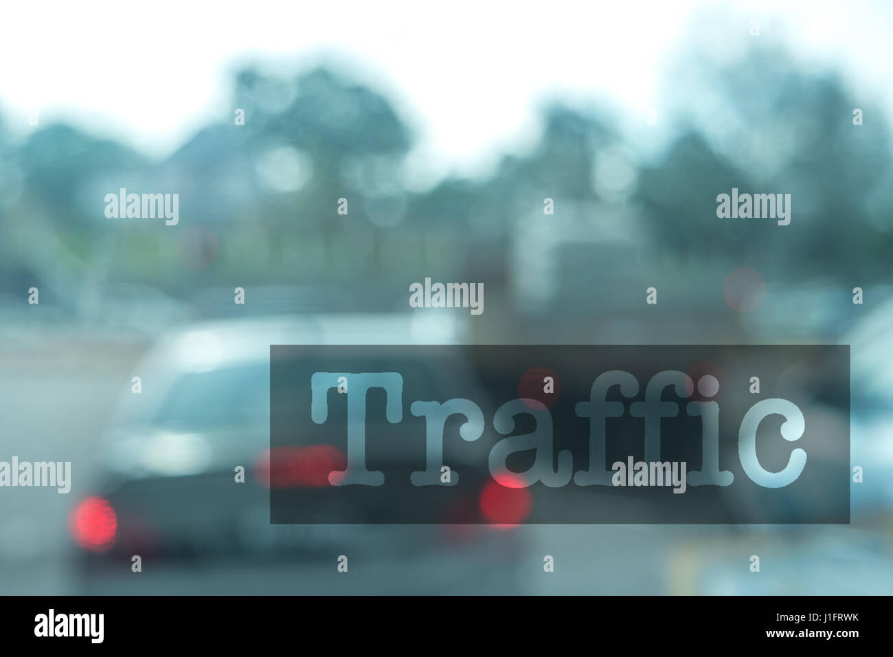 Traffic text with blurred background Stock Photo - Alamy