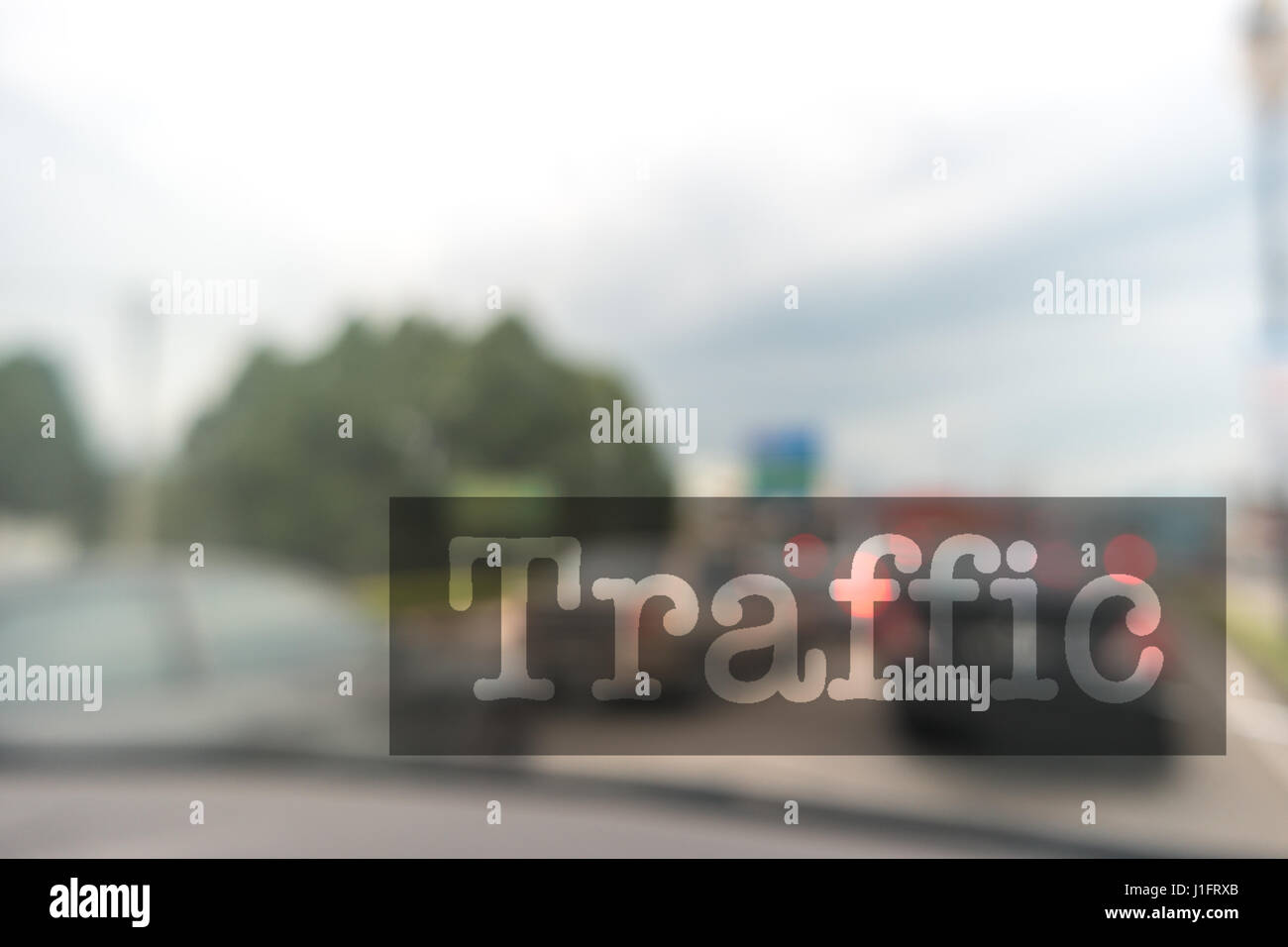 Traffic text with blurred background Stock Photo - Alamy