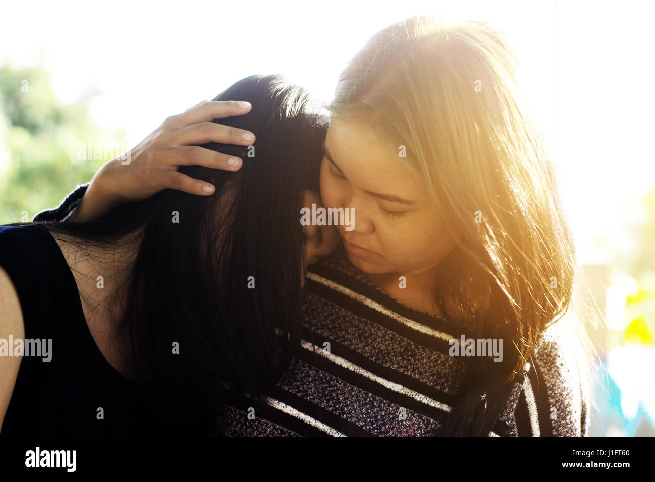 Two Sad Friends Hugging