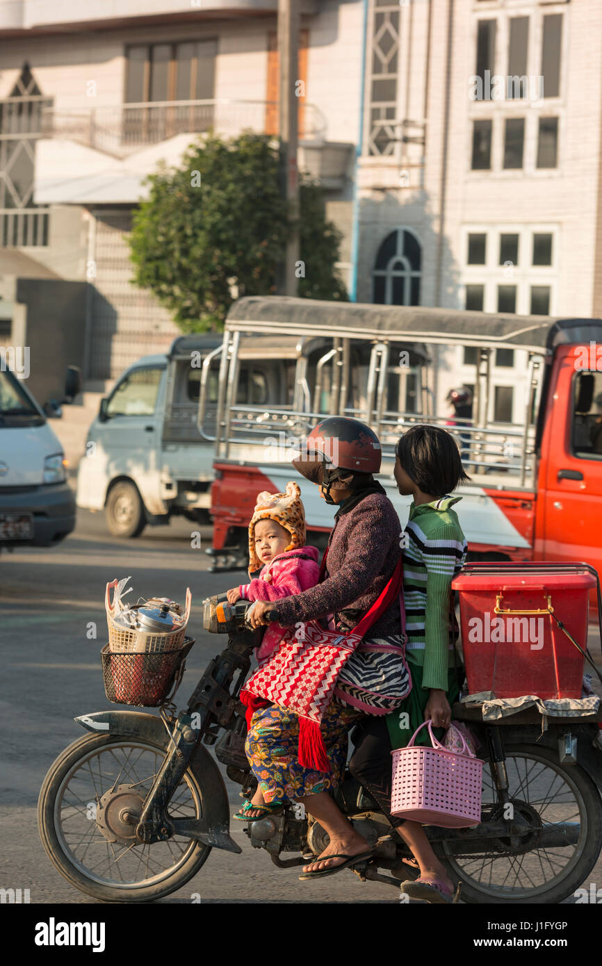 Motorcycle commuters on 80th Street, Mandalay, Myanmar Stock Photo - Alamy