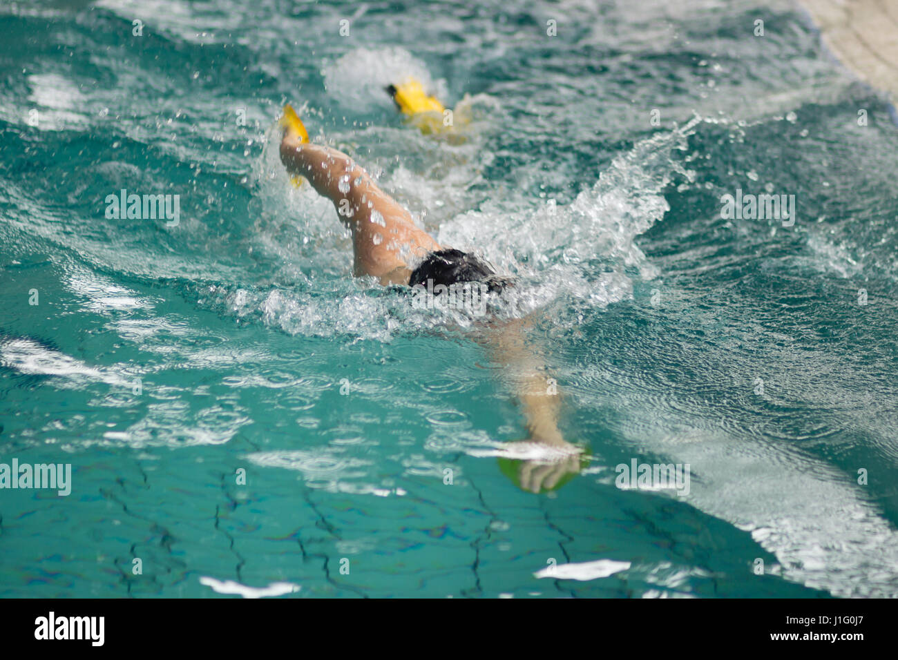 swimmer swimming in pool body in water Stock Photo - Alamy