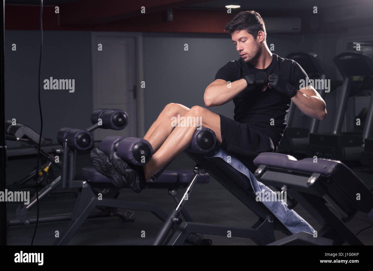 man exercise side abs core, bench gym indoors Stock Photo - Alamy