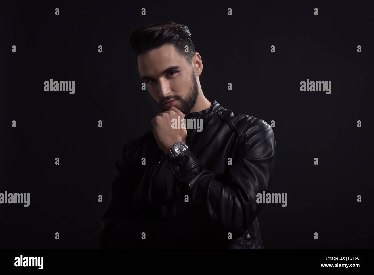 Dark portrait young man posing model. studio, black background Stock ...