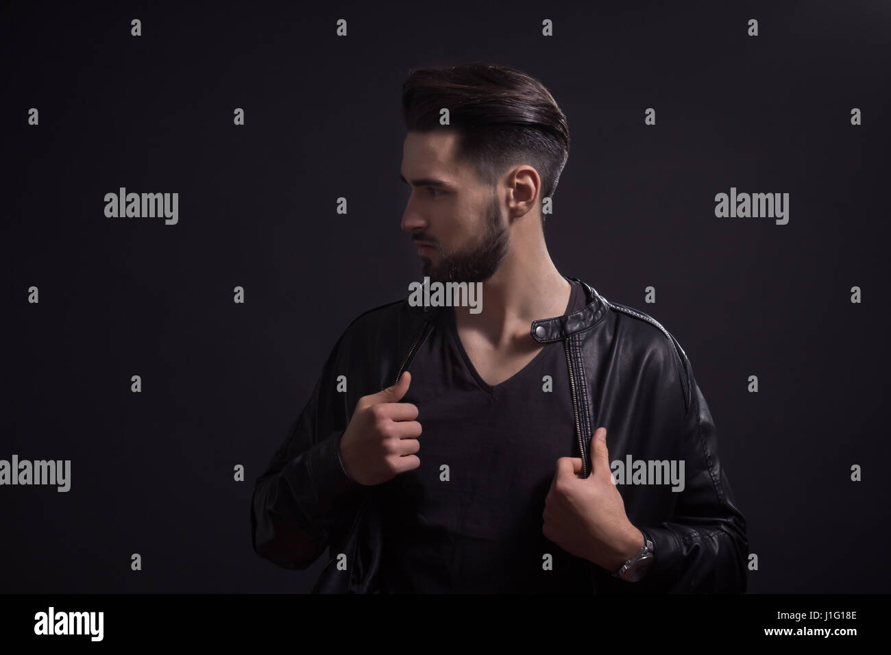 Dark portrait young man posing model. studio, black background Stock ...