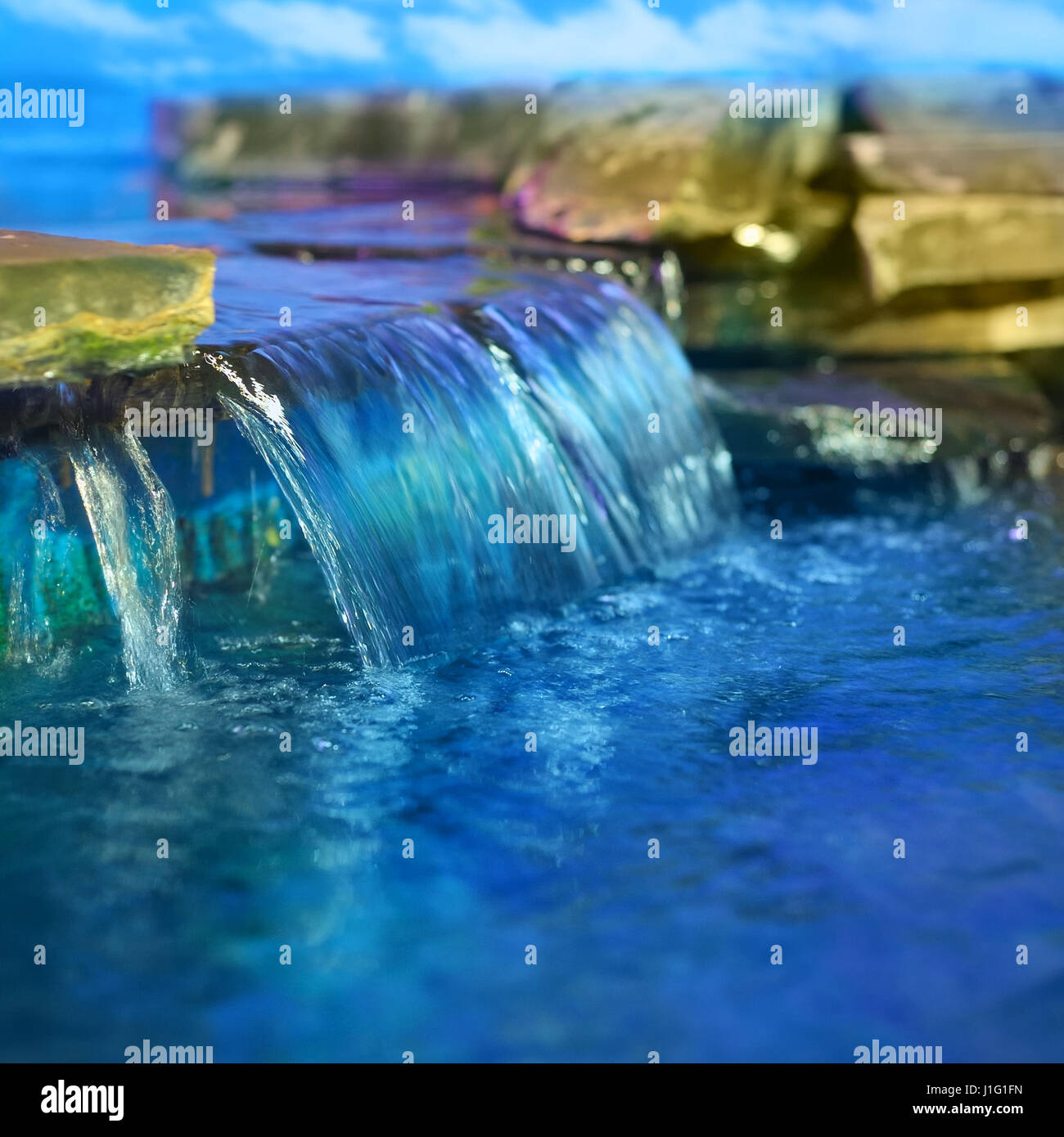 Little decorative waterfall Stock Photo - Alamy