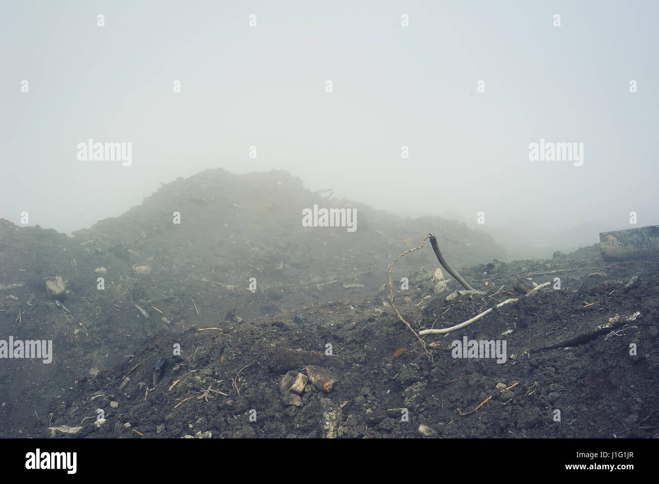 Dirty landscape with fog over land Stock Photo - Alamy