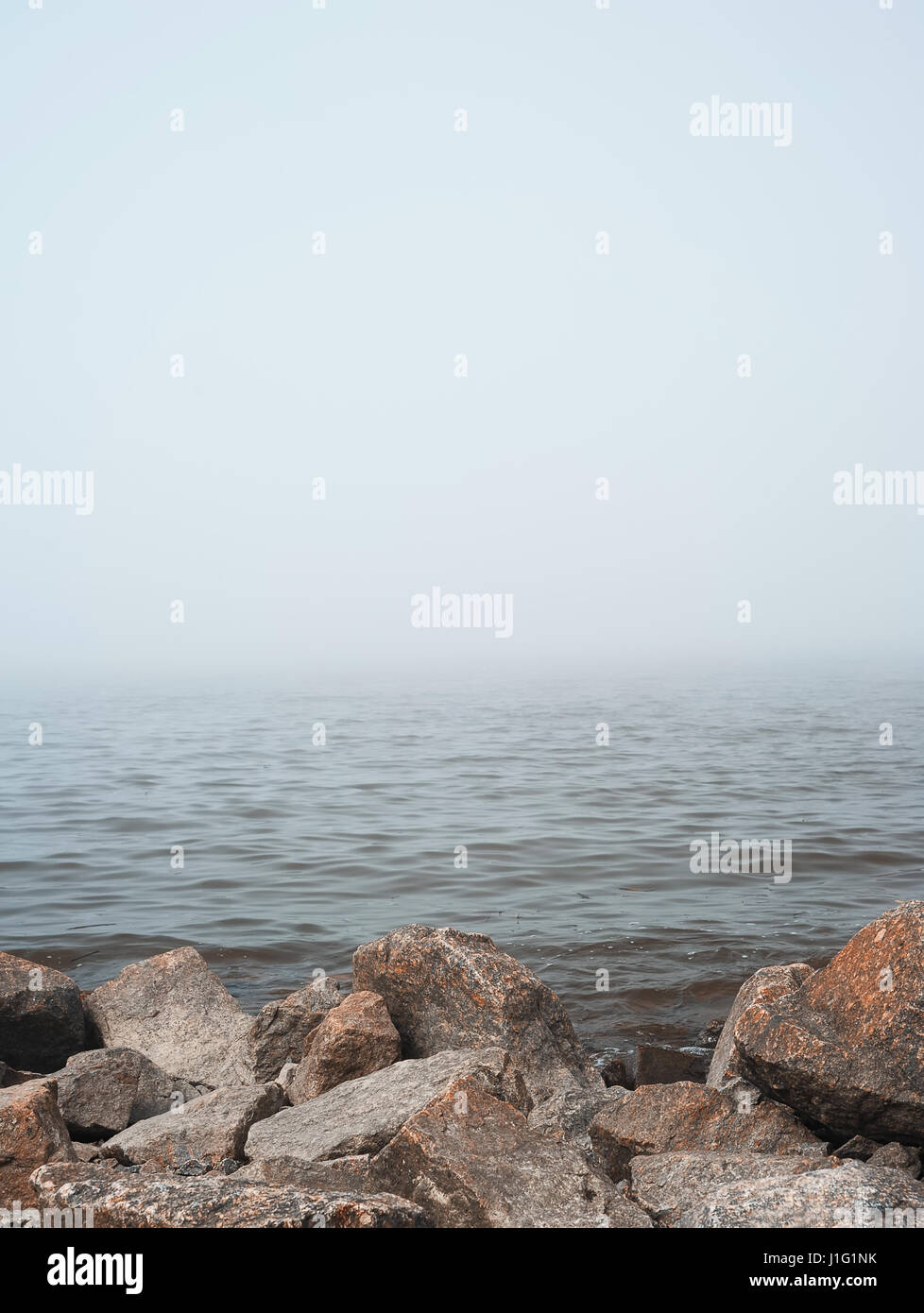Landscape with fog over lake Stock Photo - Alamy