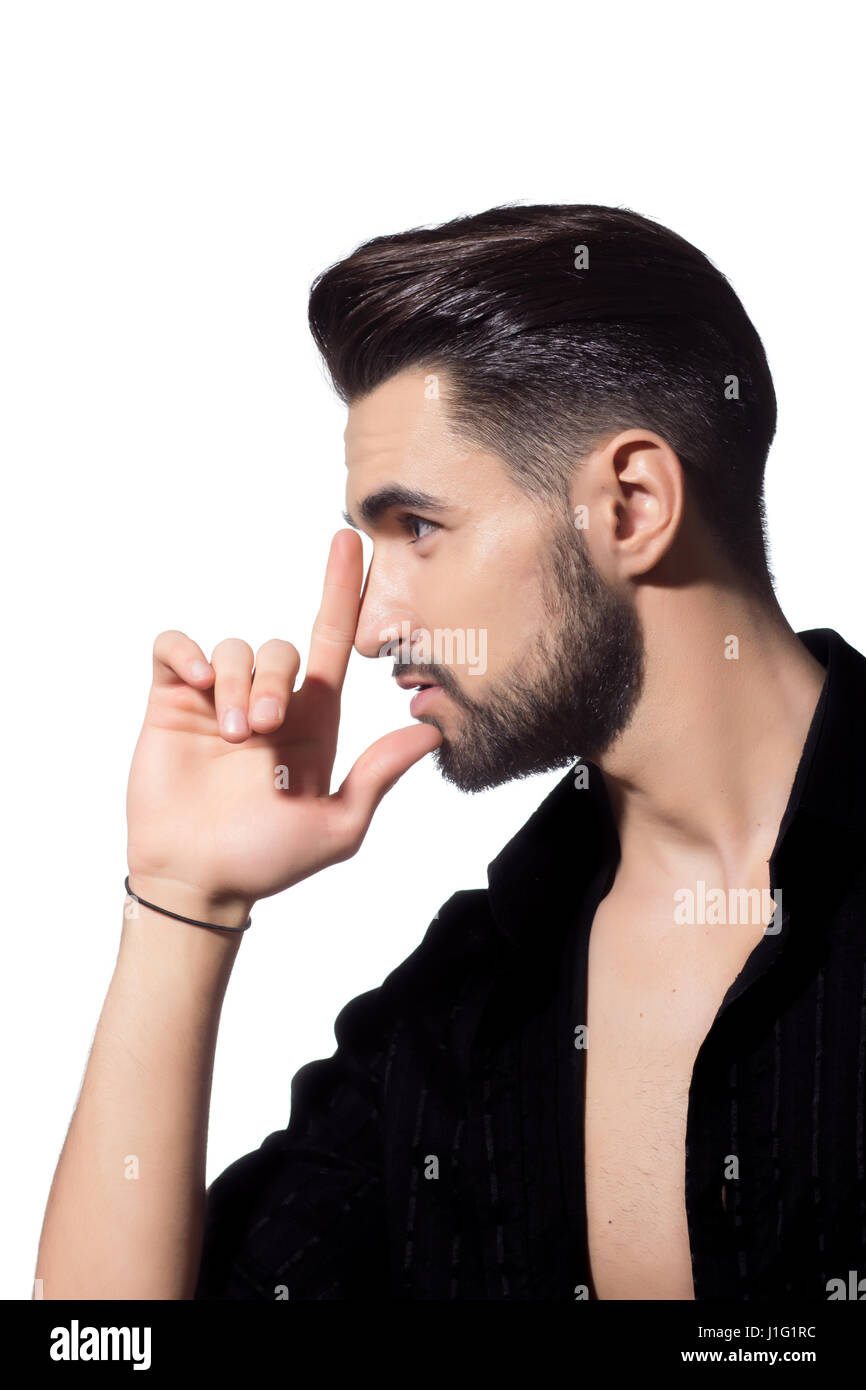 Young adult handsome man, model posing profile hand raised. Isolated ...