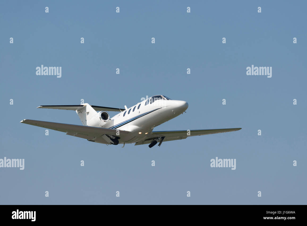 Business Jet directly after takeoff accelerating with withdrawing ...
