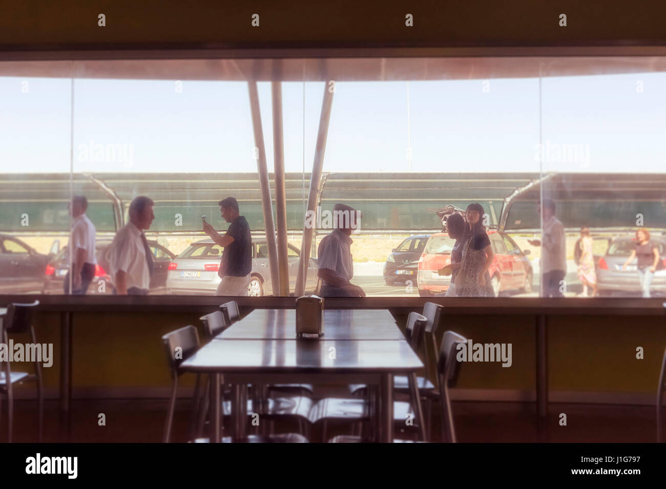 People walking on the street viewed from inside a window Stock Photo ...