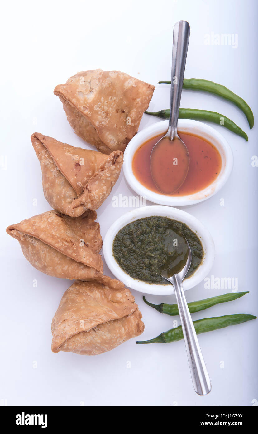 Mumbai / India 12 April 2017 four Indian Vegetable Samosa with green ...