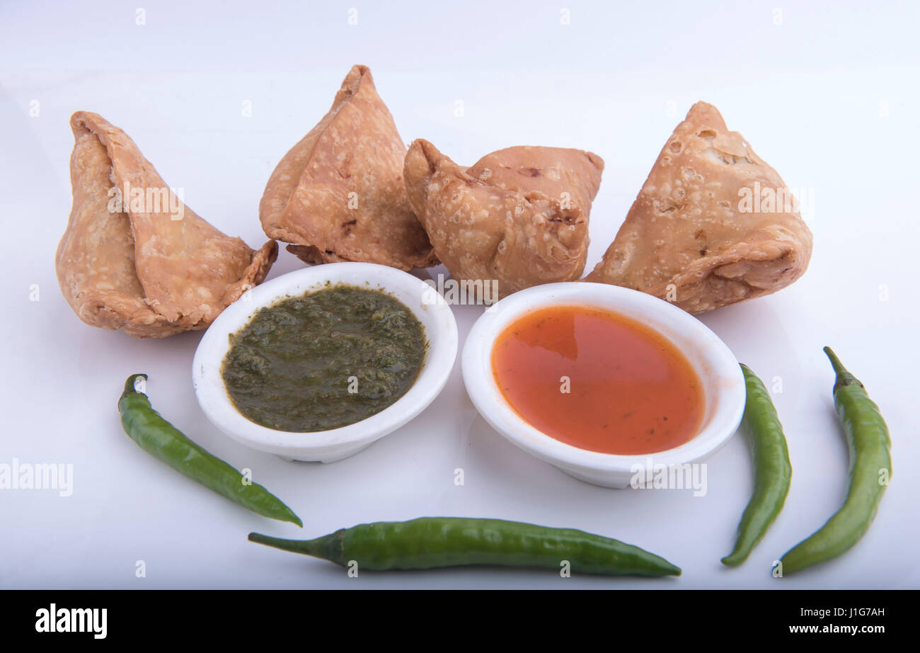 Mumbai / India 12 April 2017 four Indian Vegetable Samosa with green ...