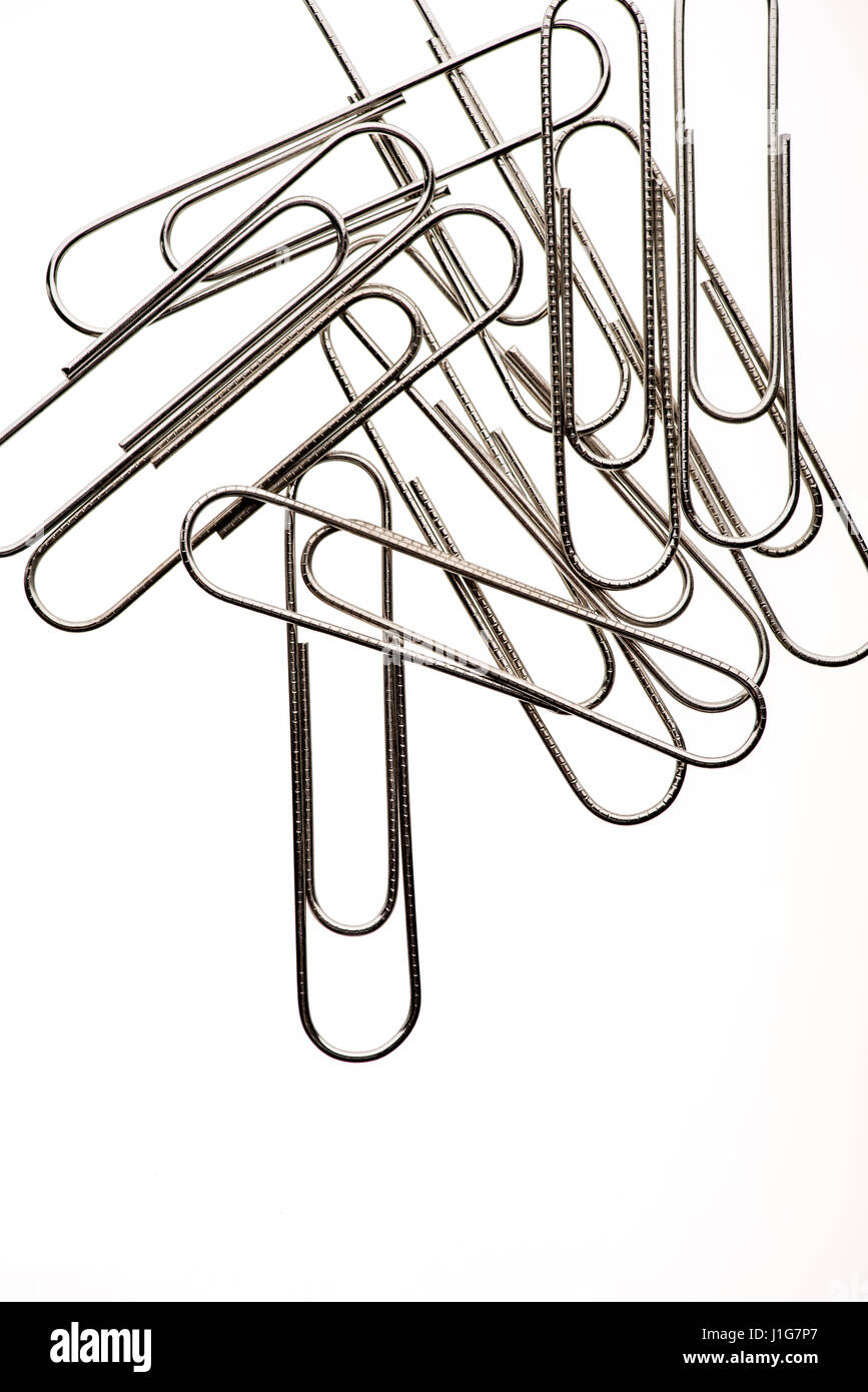 Close-up view of pile of paper clips on white background Stock Photo ...