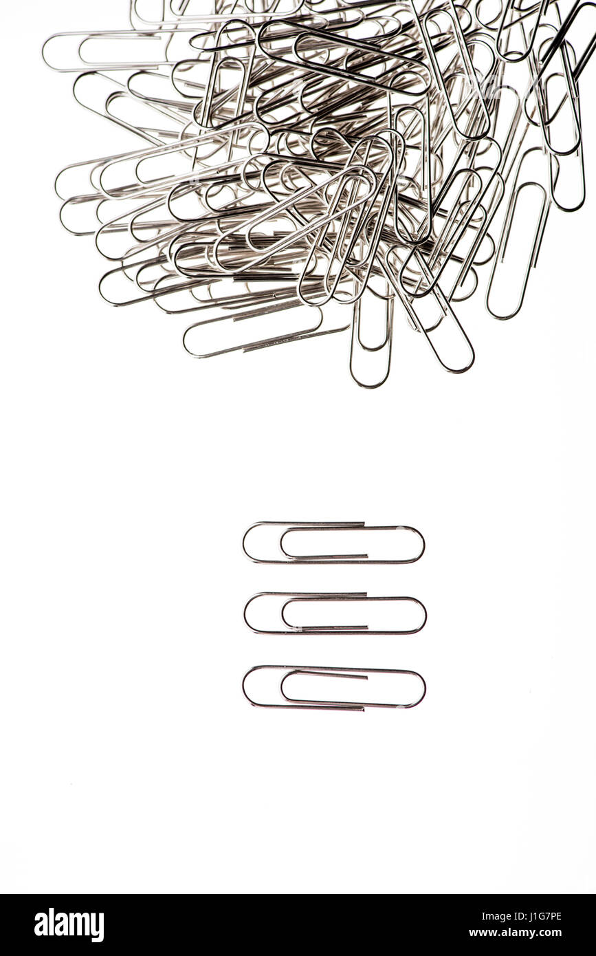 Close-up view of pile of paper clips on white background Stock Photo ...