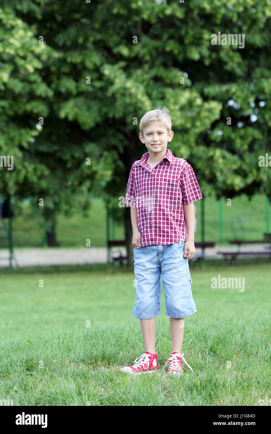 happy boy posing in park Stock Photo - Alamy