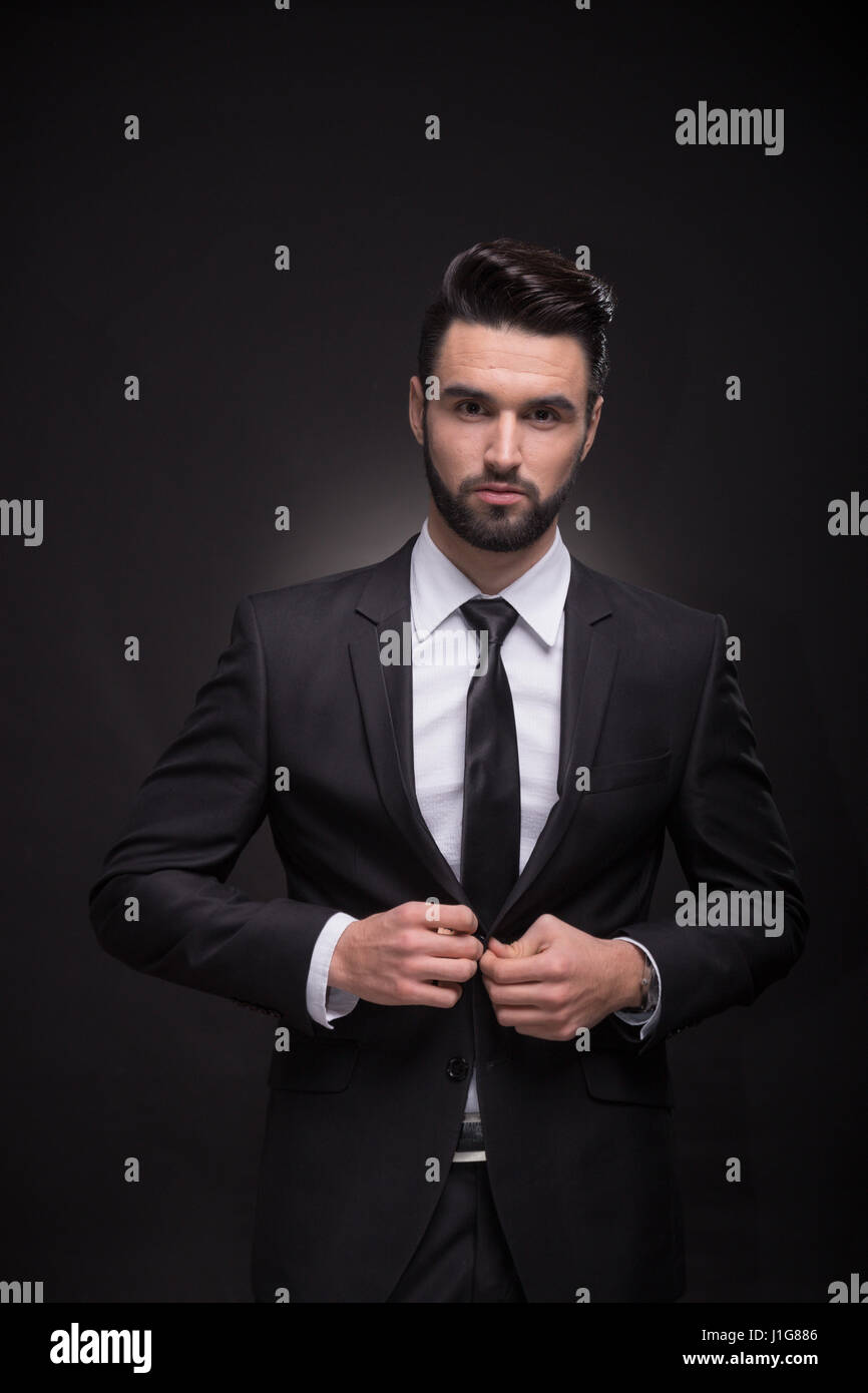 one young man elegant suit, handsome, good looking, looking at camera ...