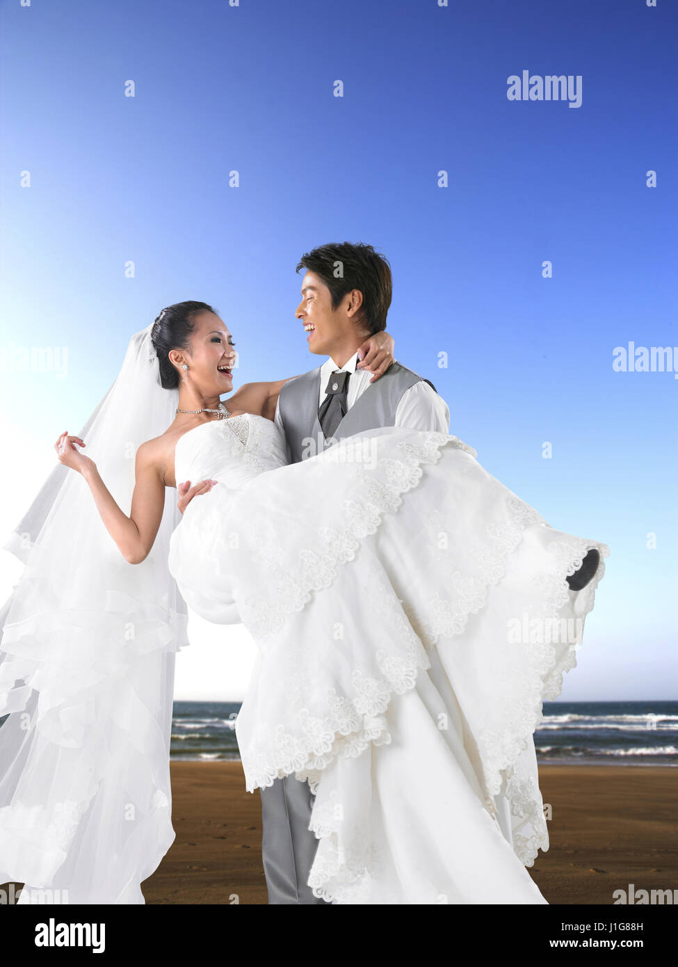 Picking up his bride hi-res stock photography and images - Alamy