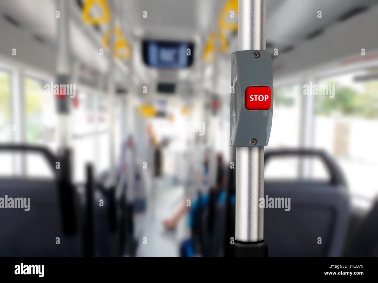 Bus stop button with empty seats Stock Photo - Alamy