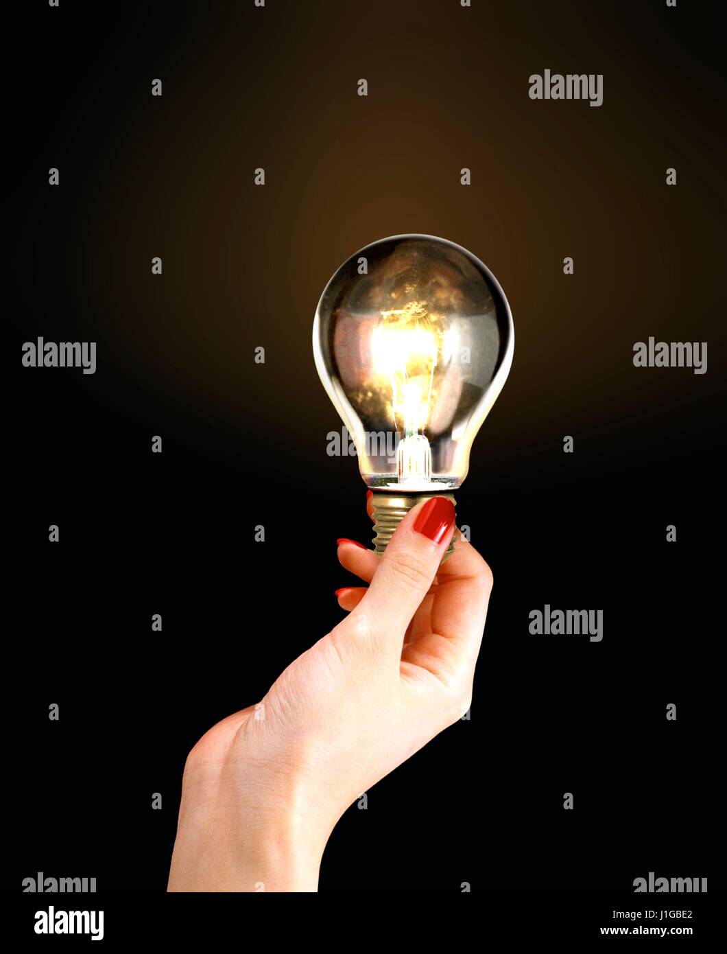 Female Hand Holding Light Bulb Stock Photo - Alamy