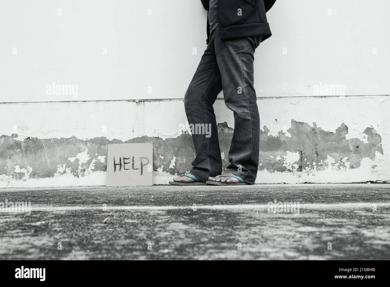 Homeless person with help sign Stock Photo - Alamy