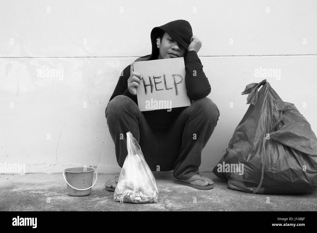 Homeless person with help sign Stock Photo - Alamy