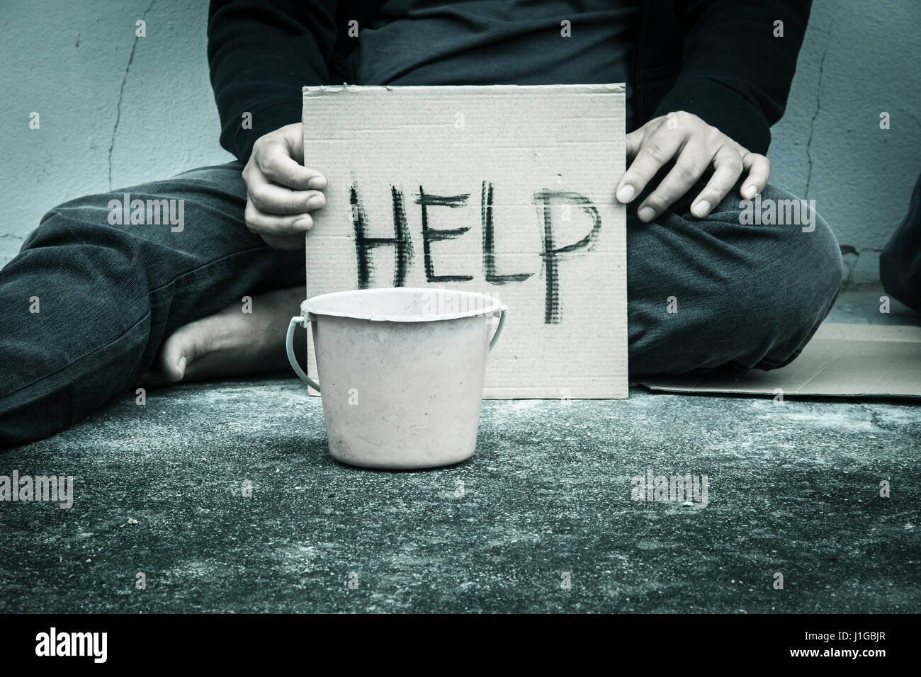 Homeless person with help sign Stock Photo - Alamy