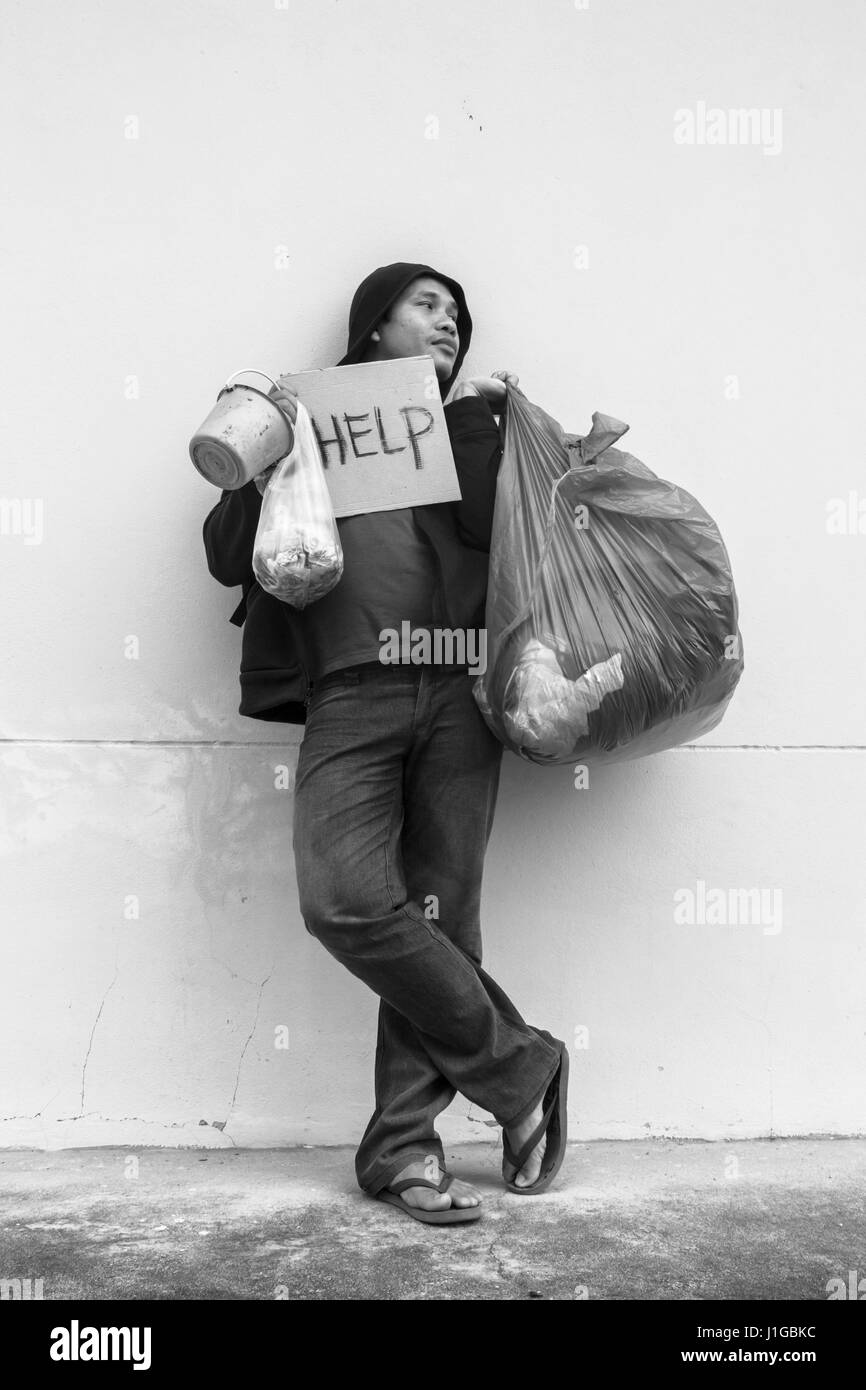 Homeless person with help sign Stock Photo - Alamy