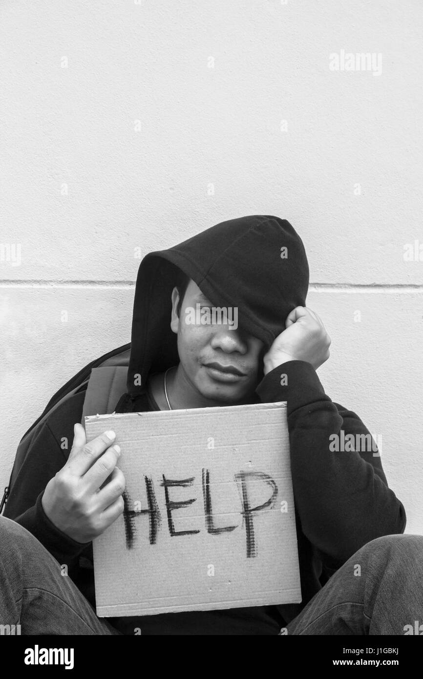 Homeless person with help sign Stock Photo - Alamy