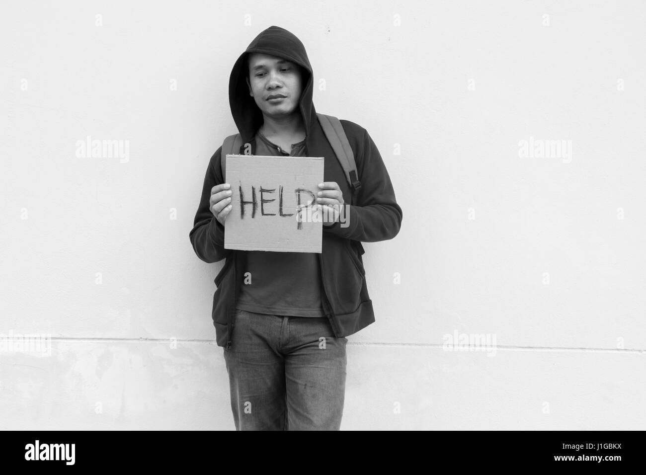 Homeless person with help sign Stock Photo - Alamy