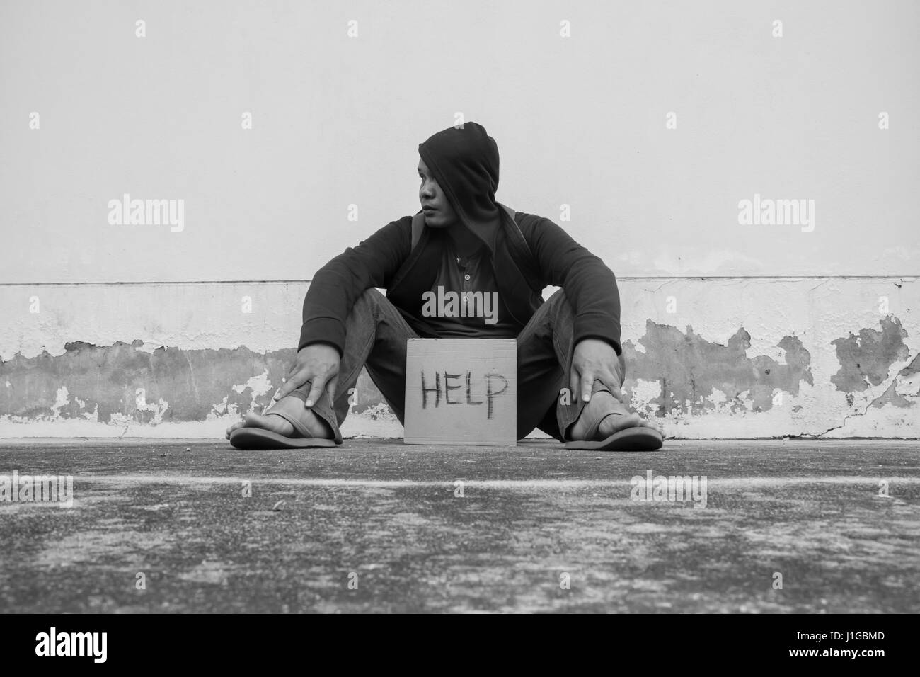 Homeless person with help sign Stock Photo - Alamy