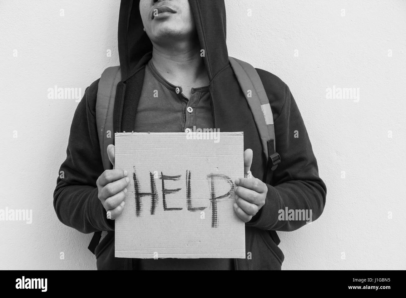 Homeless person with help sign Stock Photo - Alamy