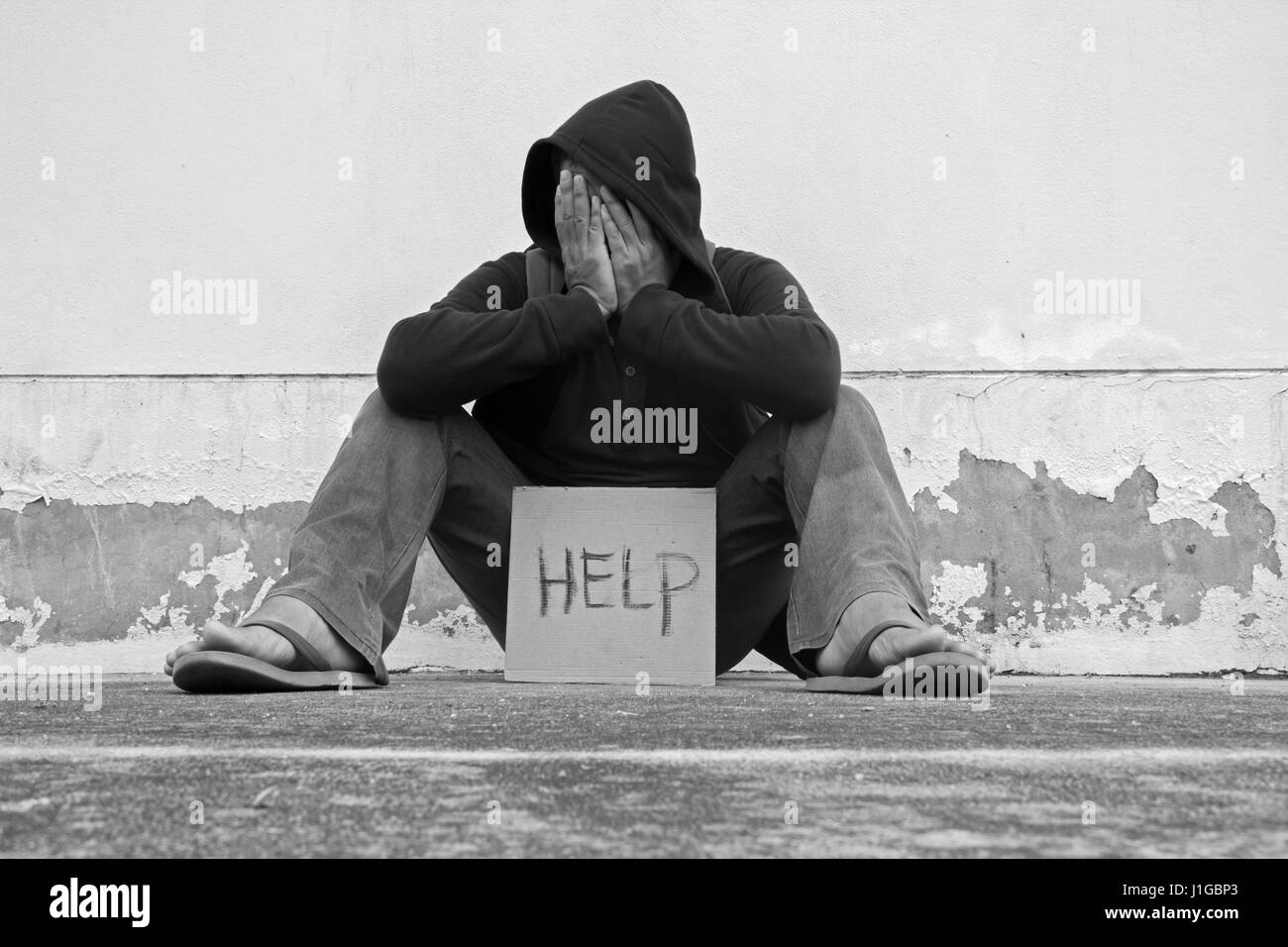 Homeless person with help sign Stock Photo - Alamy