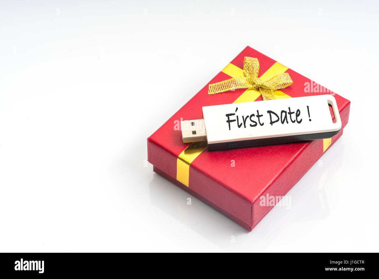 Pendrive with text and red box of gift Stock Photo - Alamy