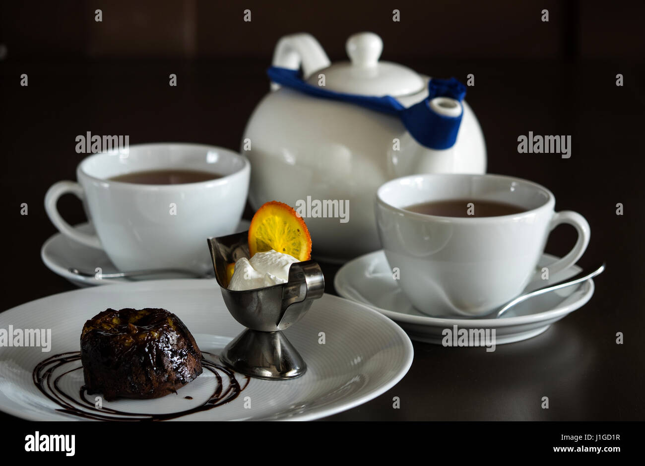 Chocolate fondant with cream Stock Photo - Alamy
