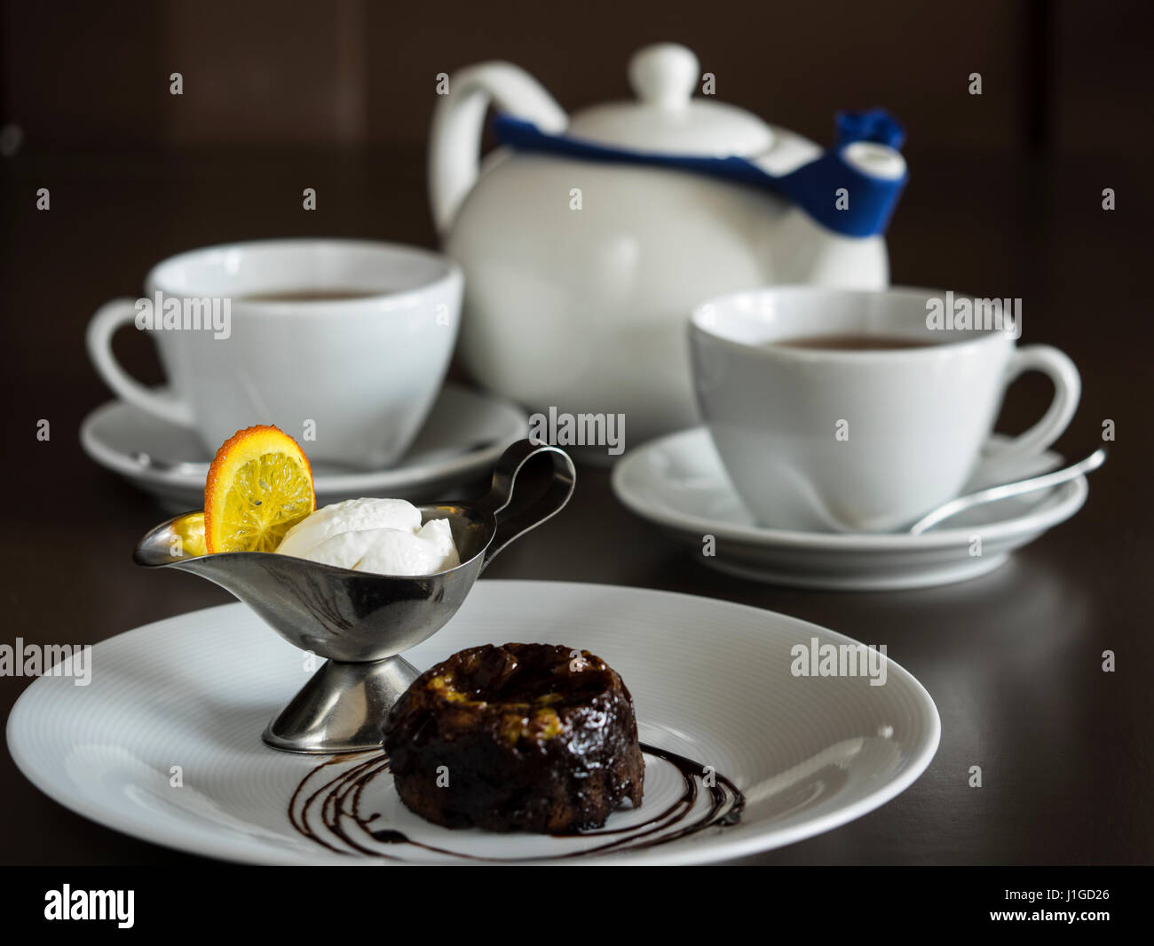 Chocolate fondant with cream Stock Photo - Alamy