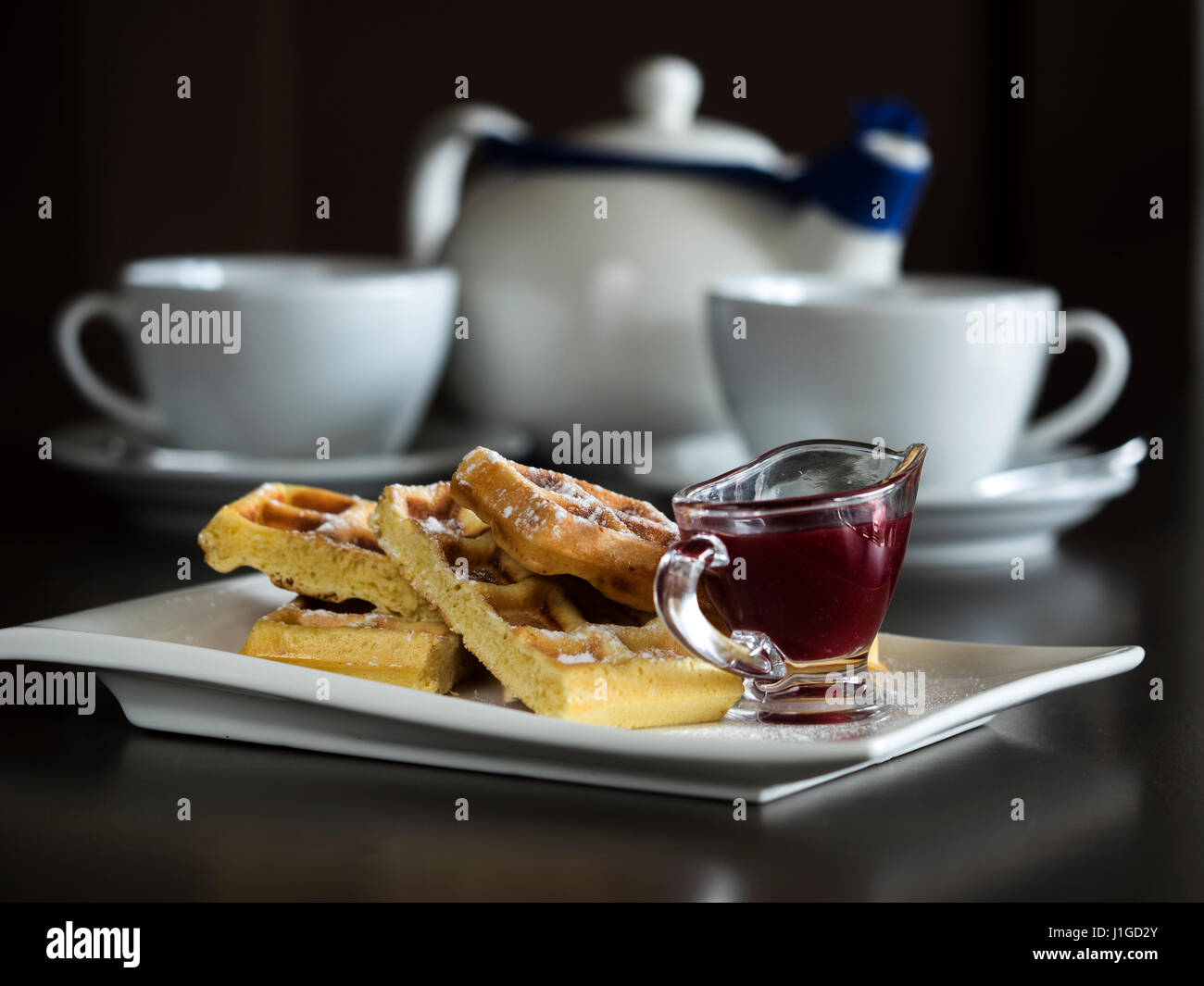 Belgian waffles with on a plate in still life Stock Photo - Alamy