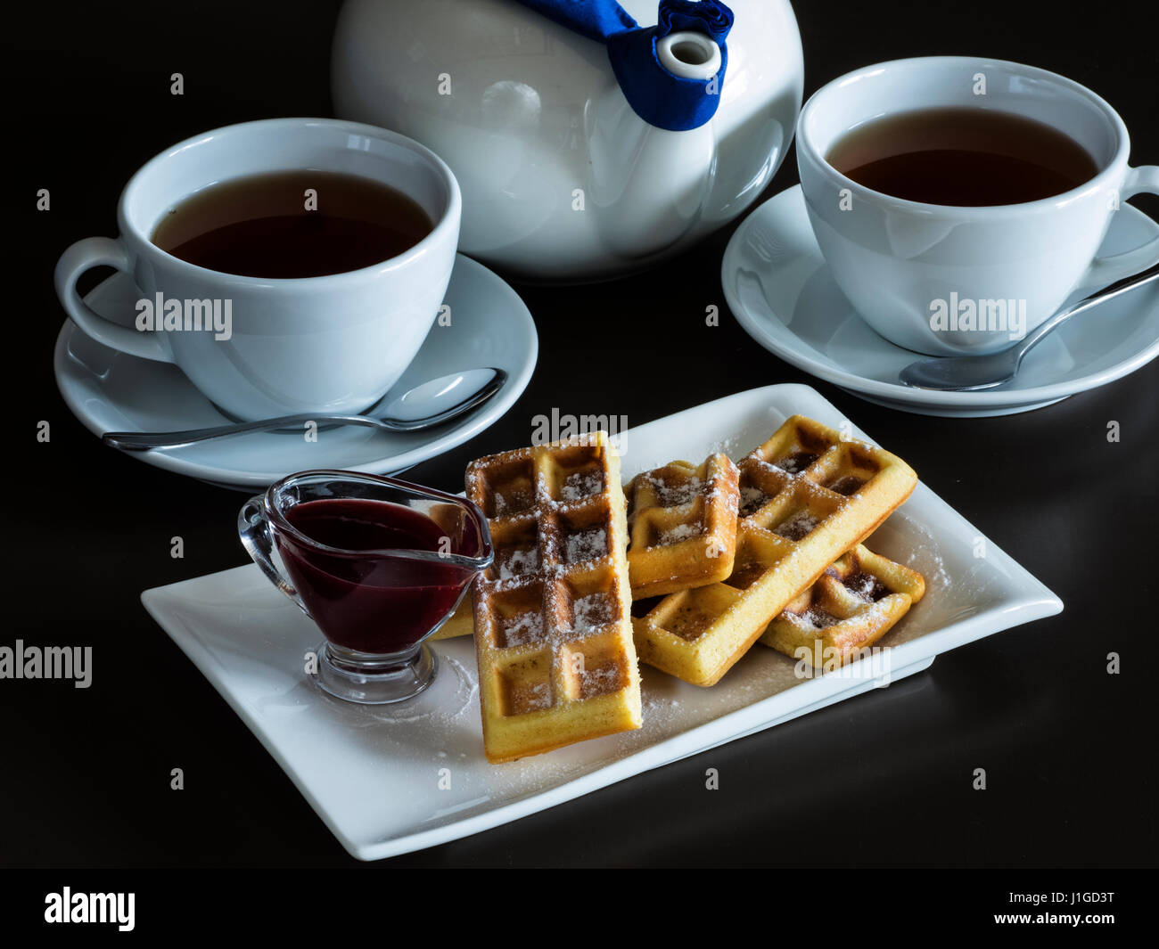 Belgian waffles with on a plate in still life Stock Photo - Alamy