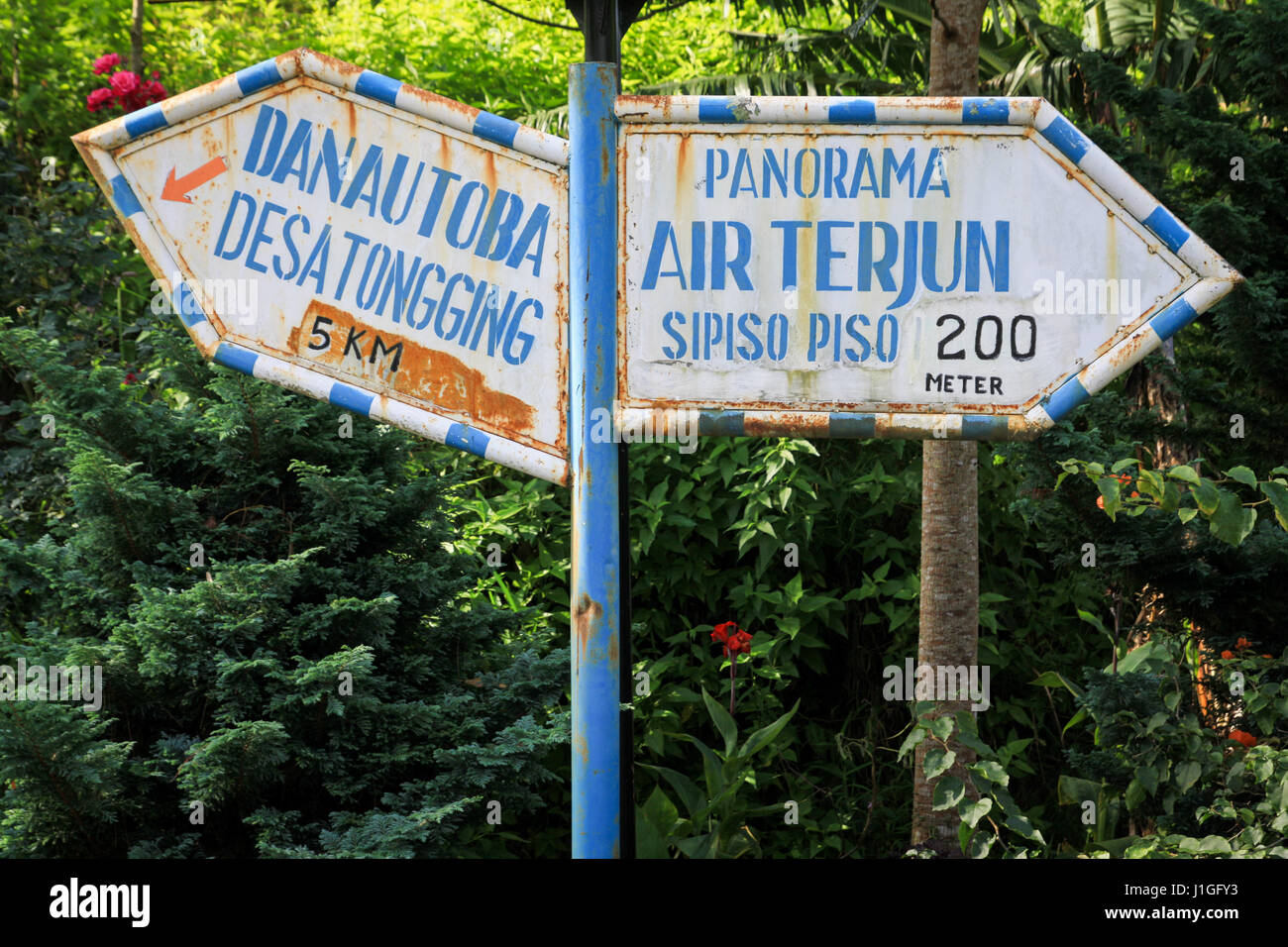 Rustic hand painted road signs for Sipiso Piso Waterfalls and Lake Toba ...