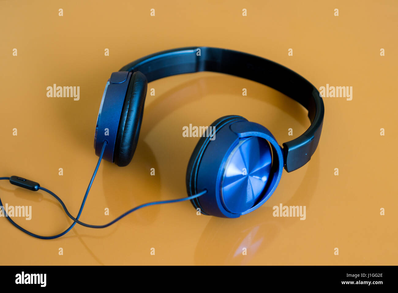 headphones isolated on brown background Stock Photo - Alamy