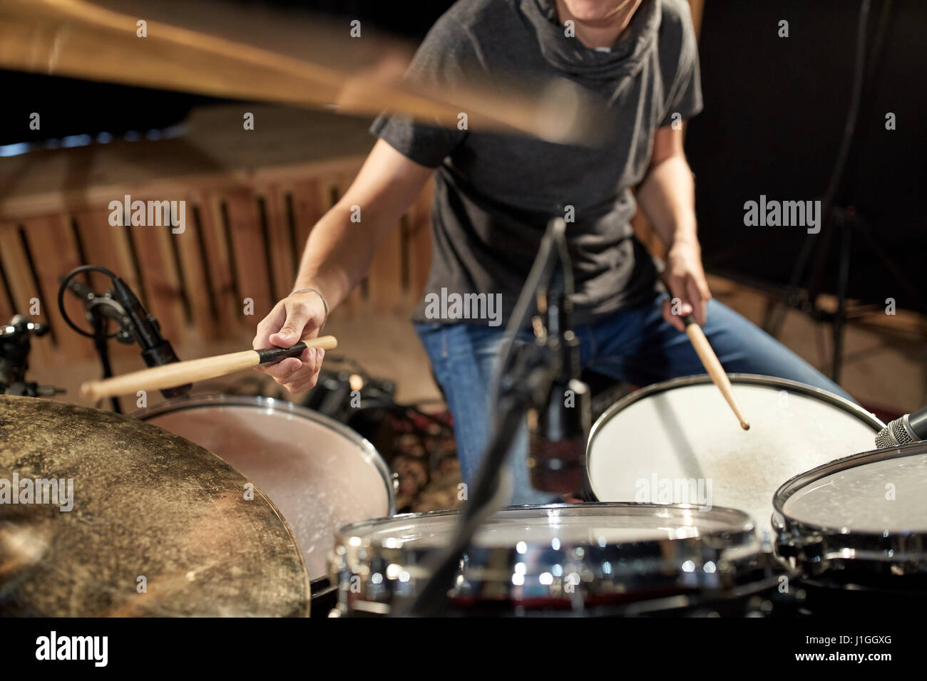 male musician playing drums and cymbals at concert Stock Photo - Alamy